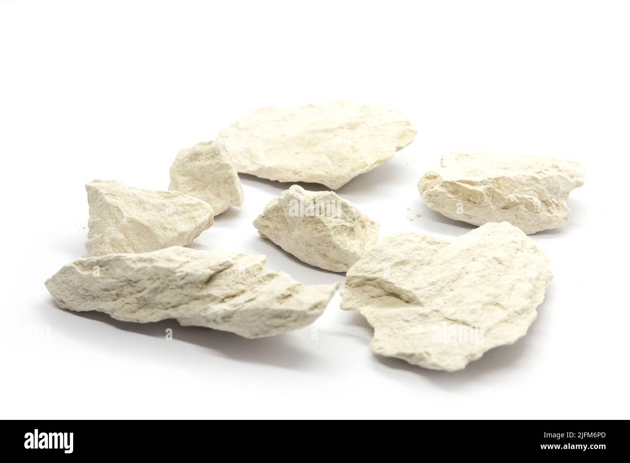 White clay pieces isolated in white background Stock Photo - Alamy