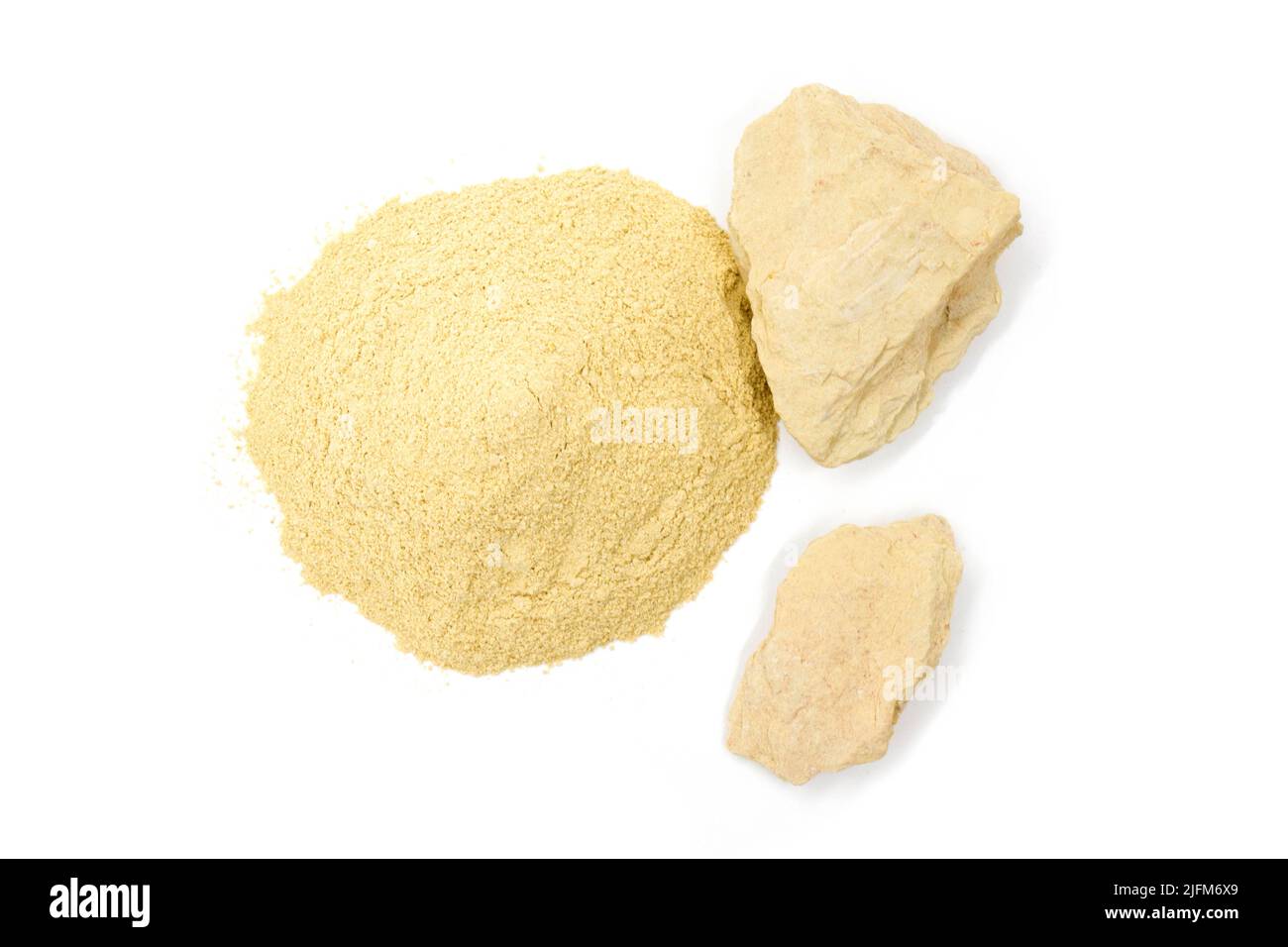 Yellow cosmetic clay in pieces and powder - top view Stock Photo - Alamy
