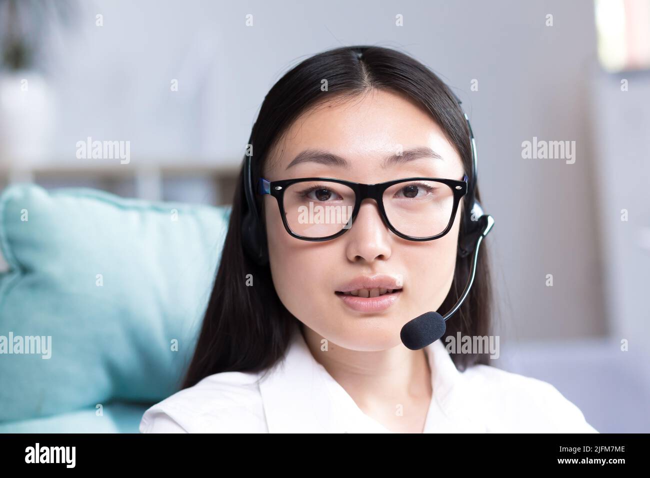 Close Up Portrait Of A Young Beautiful Asian Woman With Glasses Smiling