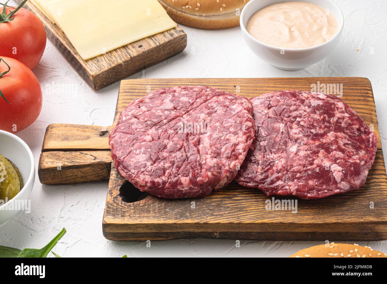 Raw Minced Steak Burgers from Beef Meat, on white stone background ...