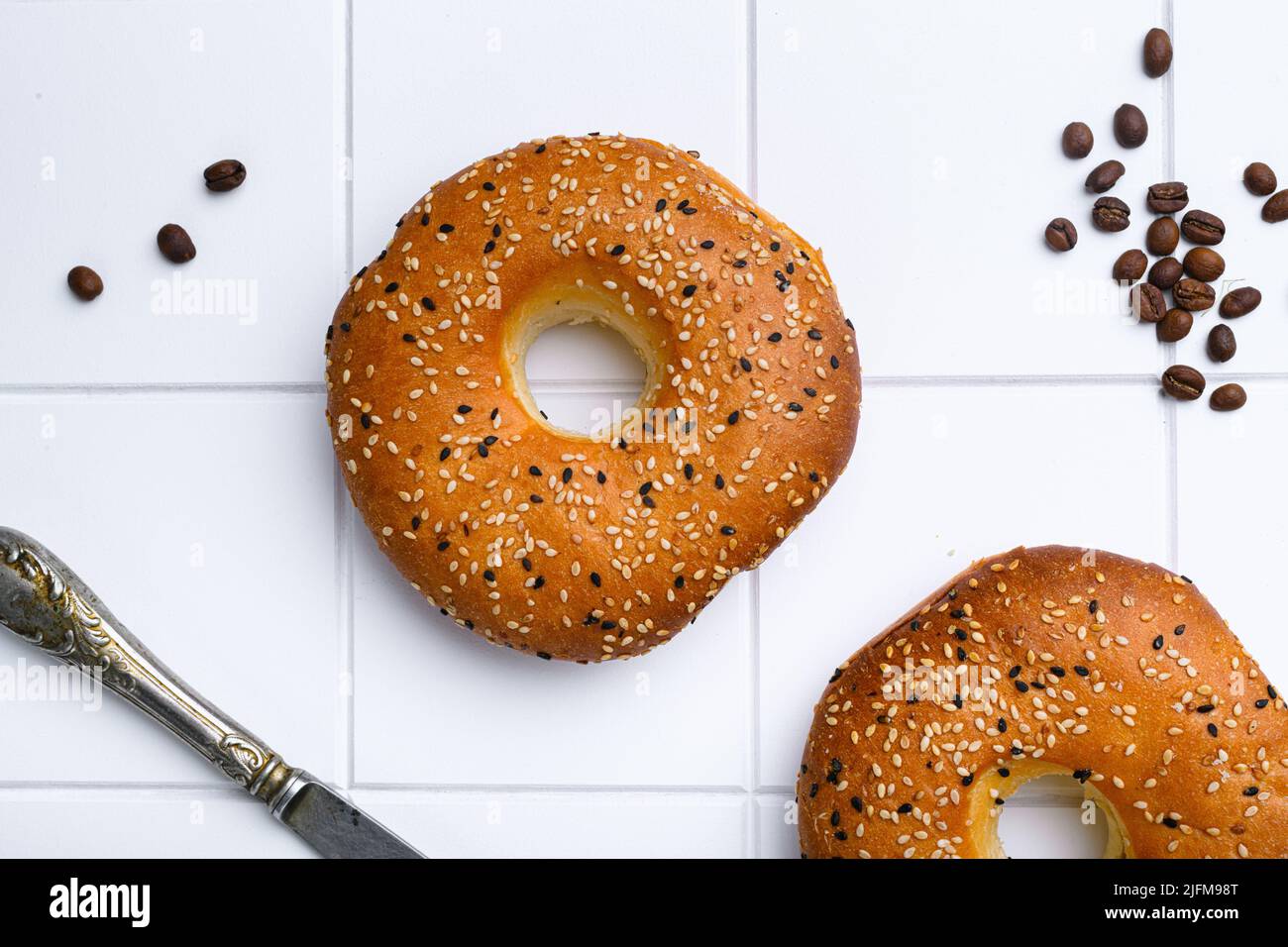 Bagel Freshly Baked set, on white ceramic squared tile table background ...
