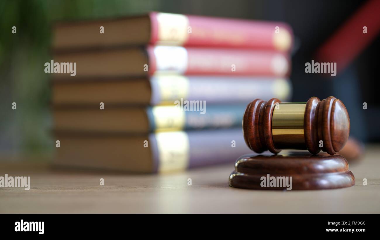 Wooden judge gavel with golden strip on sounding block Stock Photo - Alamy