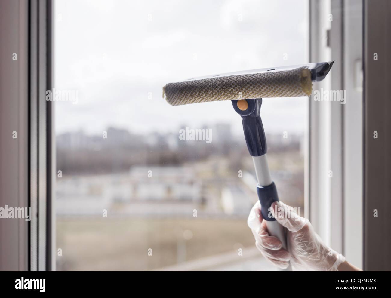 Washing and cleaning the window. Woman cleaning window glass Stock ...