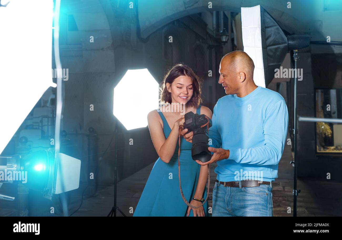successful photographer and model discussing picture on camera d Stock ...