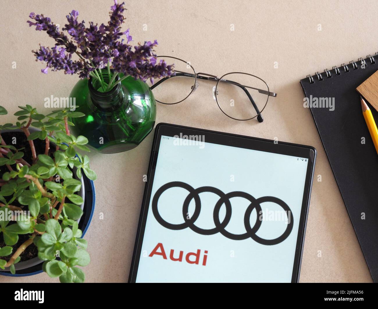 In this photo illustration Audi AG logo seen displayed on a tablet ...