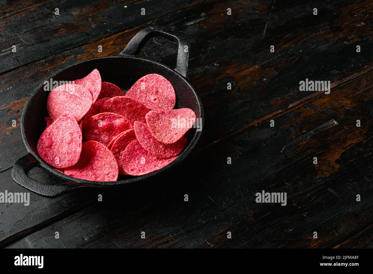 Sweet Southern Heat BBQ Flavored Red Potato Chips on old dark wooden ...