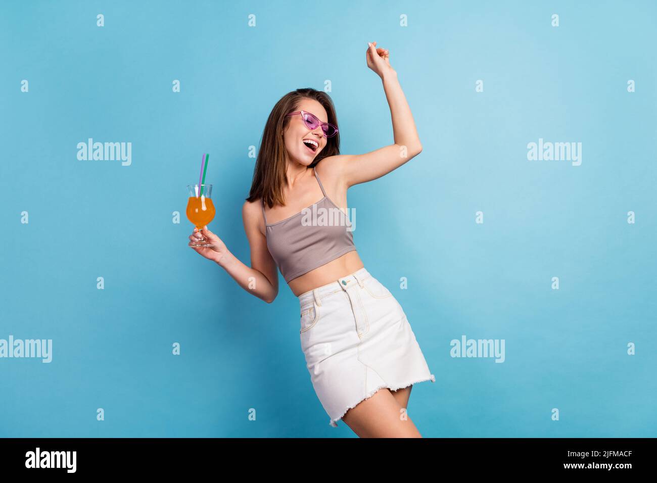 Photo of joyful young positive woman hold hands cocktail dance weekend ...