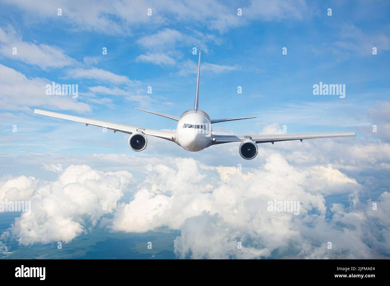 Passenger plane flying in the daytime sky overcast, cloudscape Stock ...