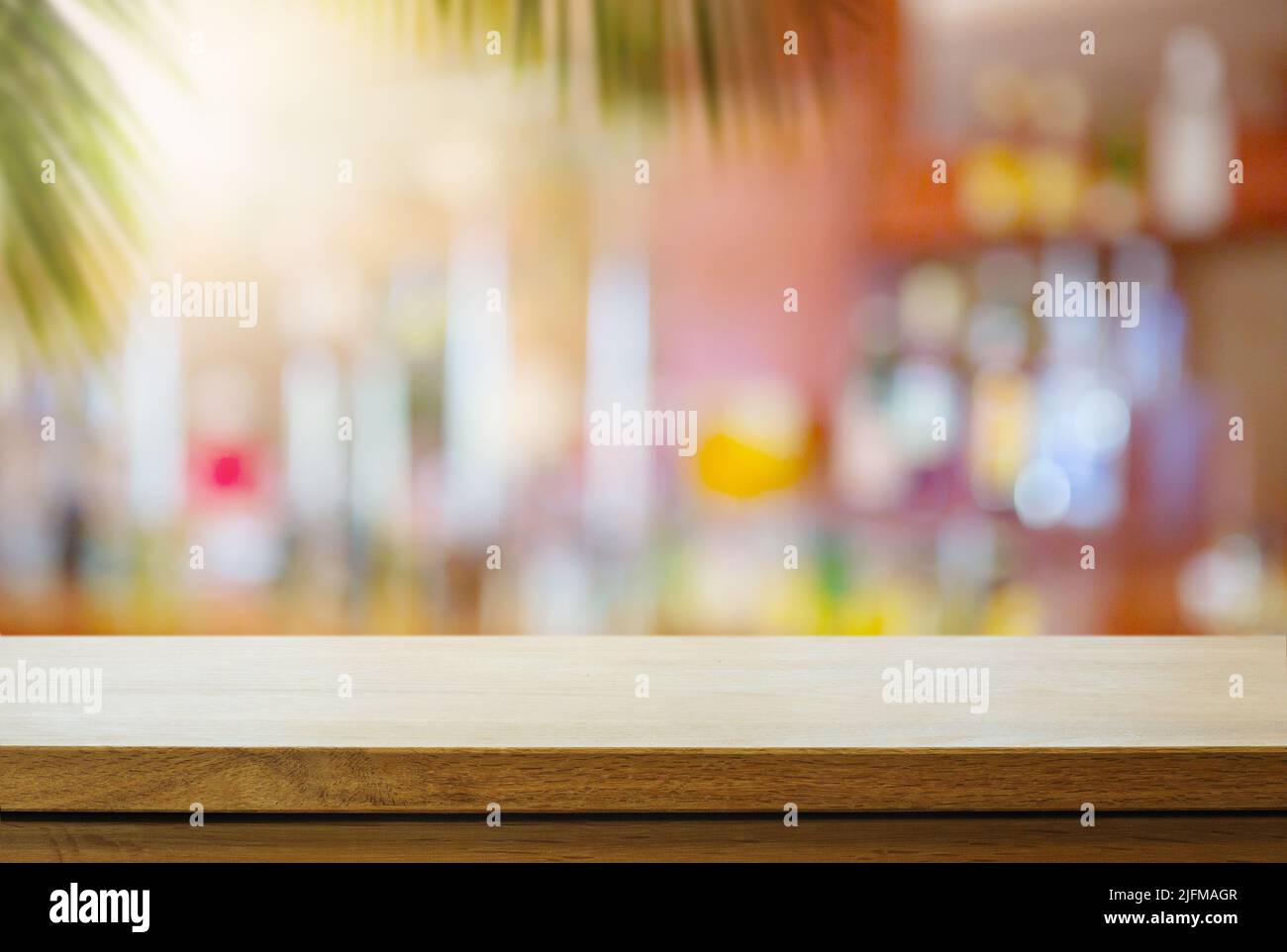 Empty wooden table on sunny blurred tropical bar background. Outdoor ...
