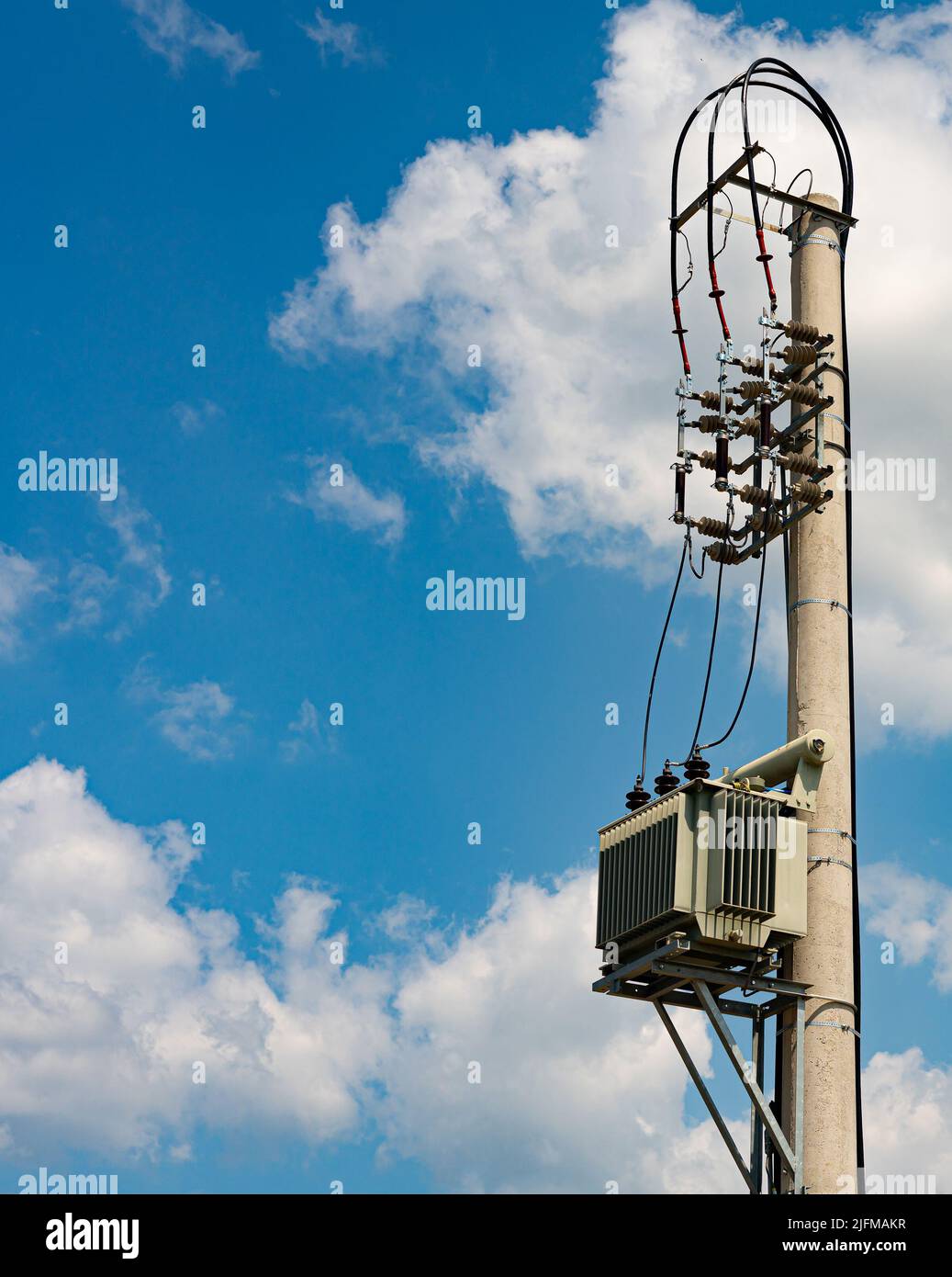 Private electrical transformer mounted on a special pole against the ...