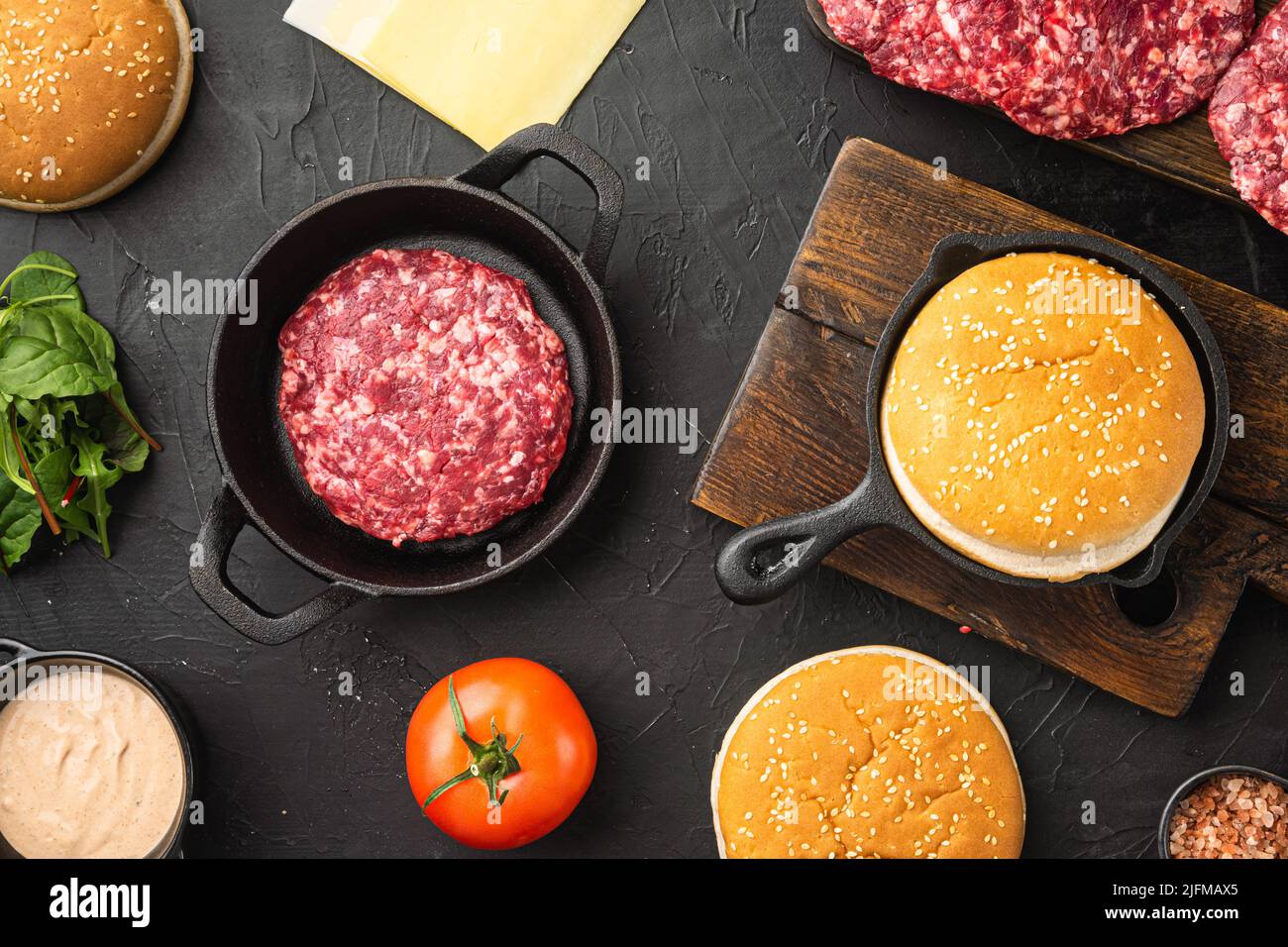 Burger banner. Raw ingredients for burger, on black stone background ...