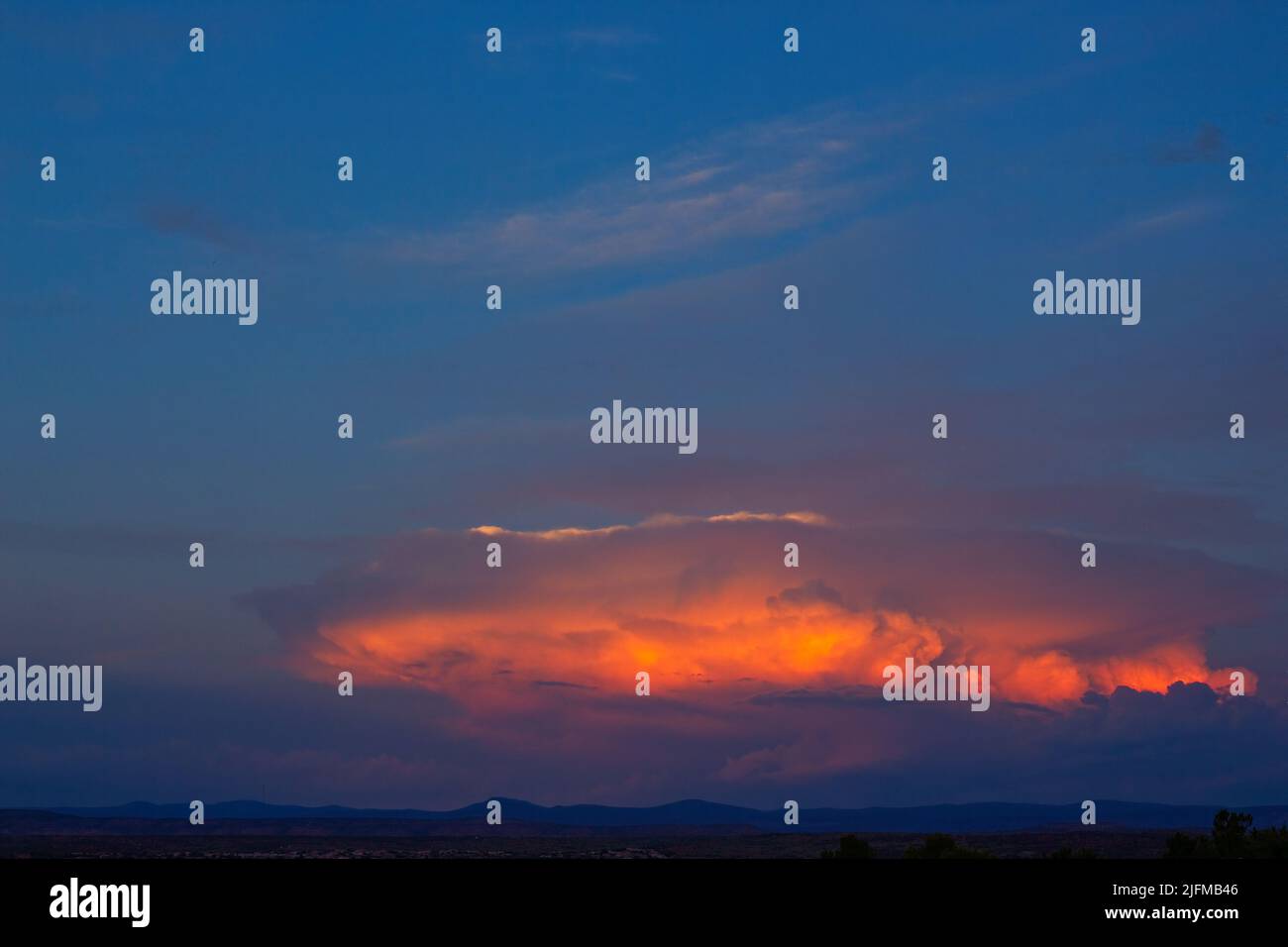 A giant orange storm cloud over the desert Stock Photo - Alamy