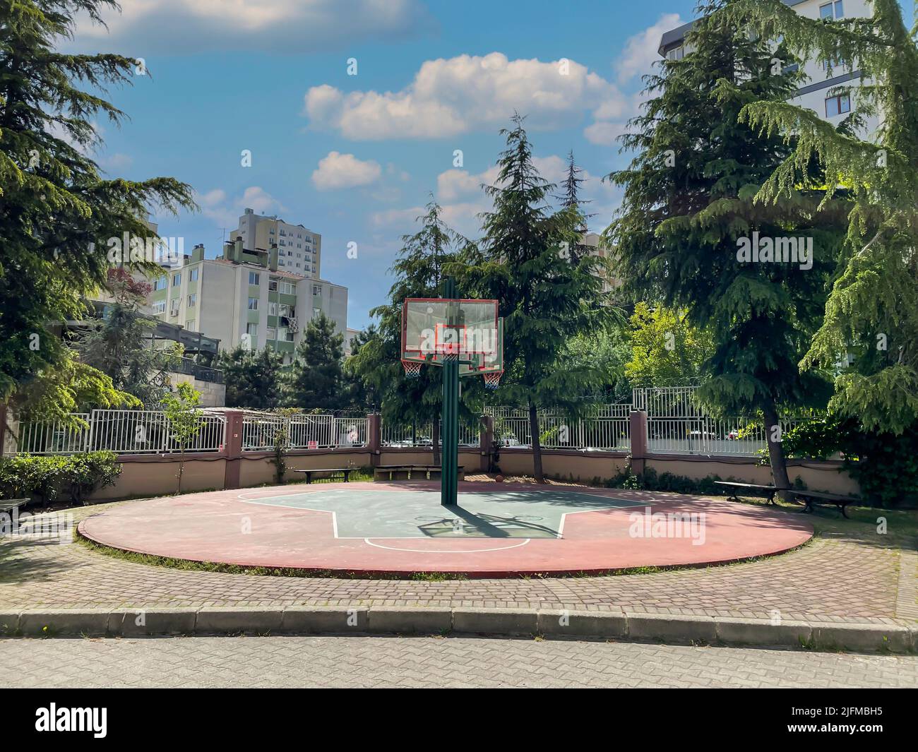 Outdoor basketball hoop, Basketball court with three baskets surrounded ...