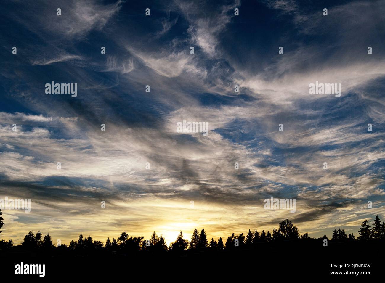 Noctilucent clouds or polar mesospheric night-shining clouds at sunset ...