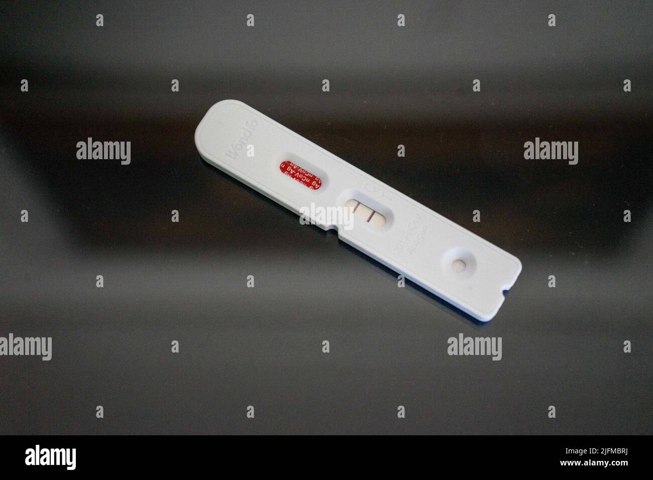 In this photo illustration covid-19 positive antigen test seen ...