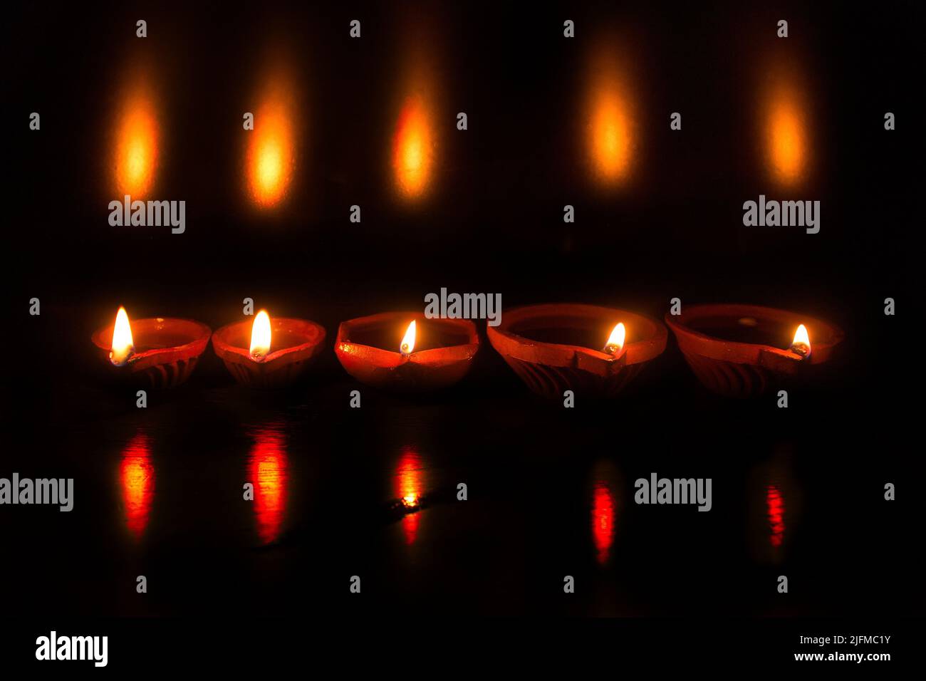 Diya lamp and oil lamp with fire and candles, color with wood grain for ...