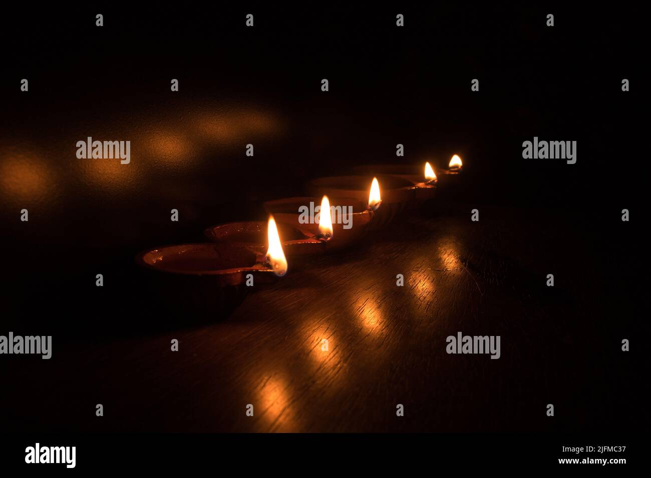 Diya lamp and oil lamp with fire and candles, color with wood grain for ...