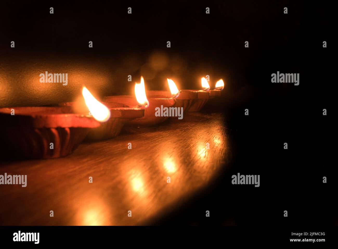 Diya lamp and oil lamp with fire and candles, color with wood grain for ...