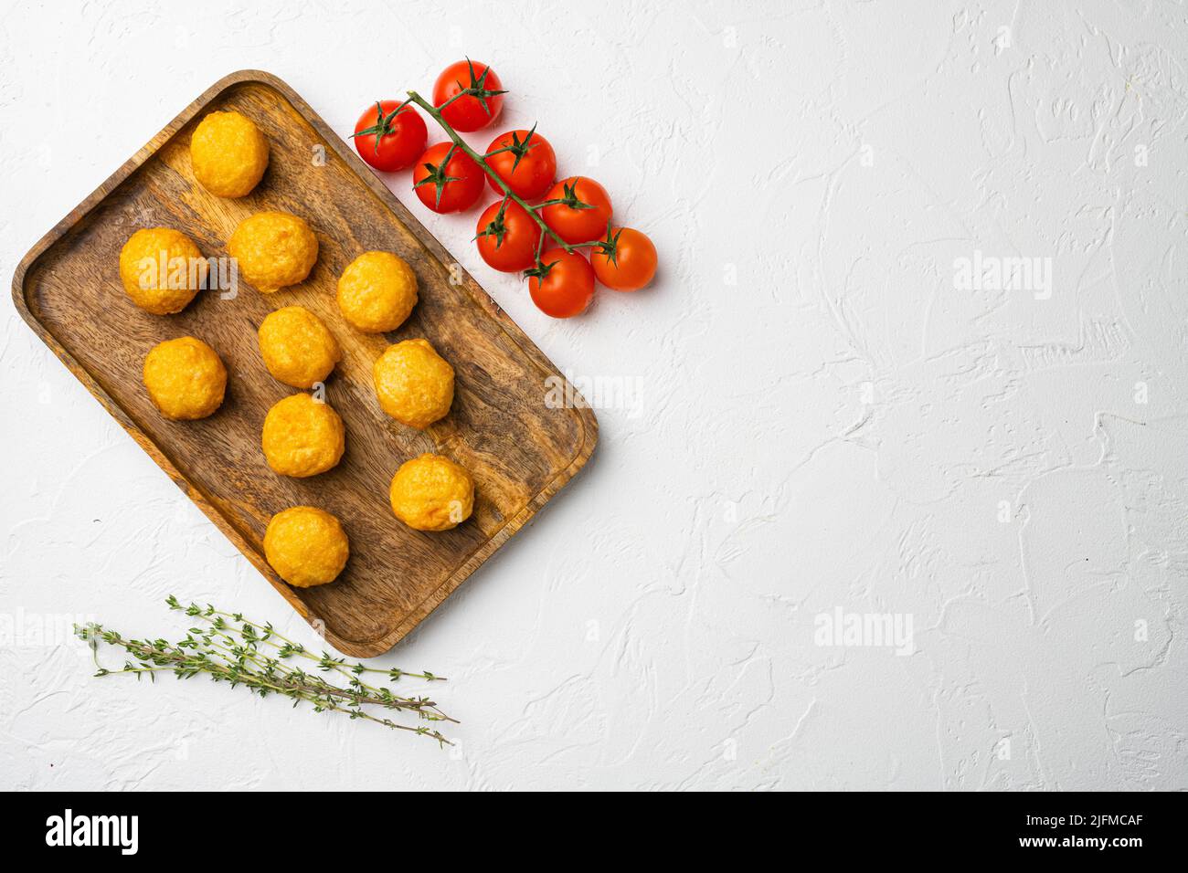 Breaded chicken fillet and batter on white stone table background, top ...
