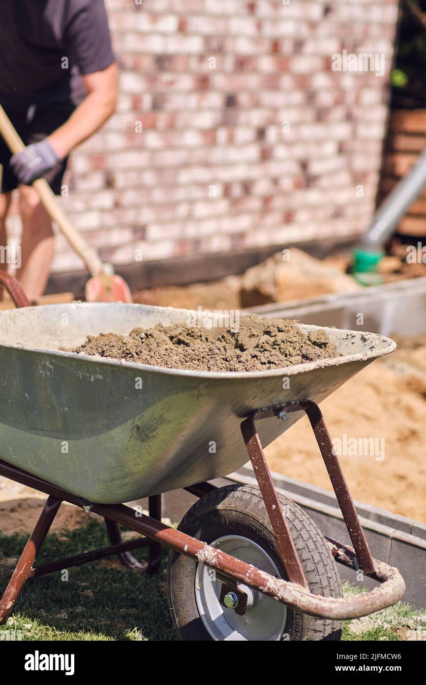 Wheelbarrow full of concrete. High quality photo Stock Photo - Alamy