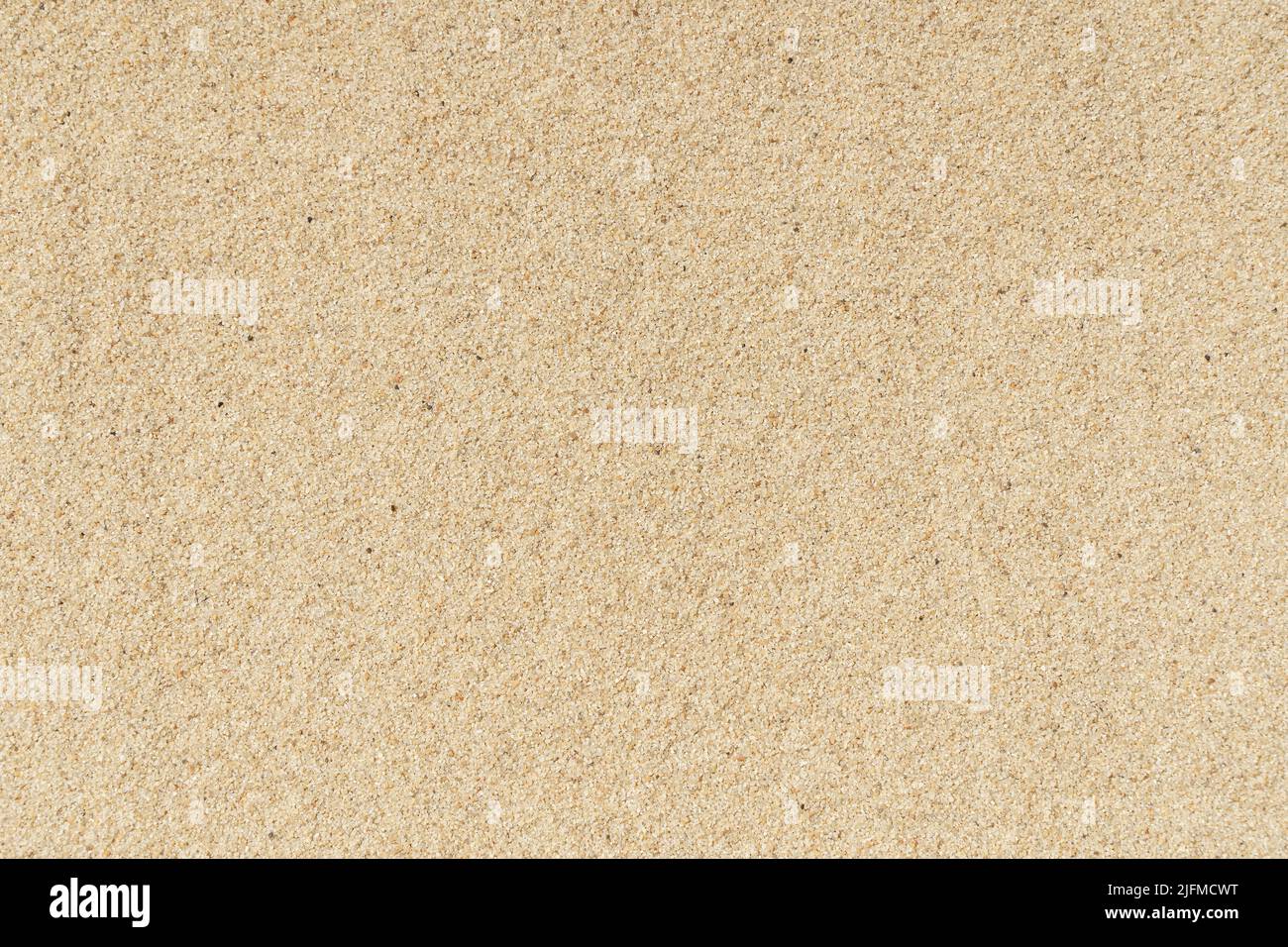 Sand beach texture background. Light hot sand on the sea coast in ...