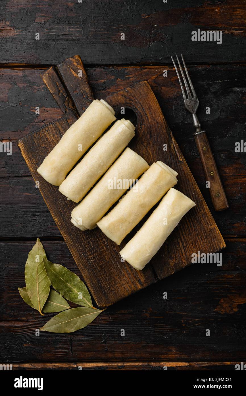 Crepes frozen on old dark wooden table background, top view flat lay ...