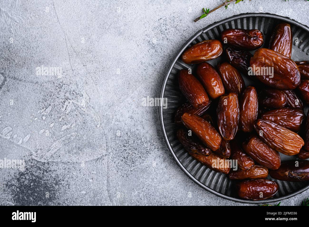 Traditional arabic dry dates set, on gray stone table background, top ...