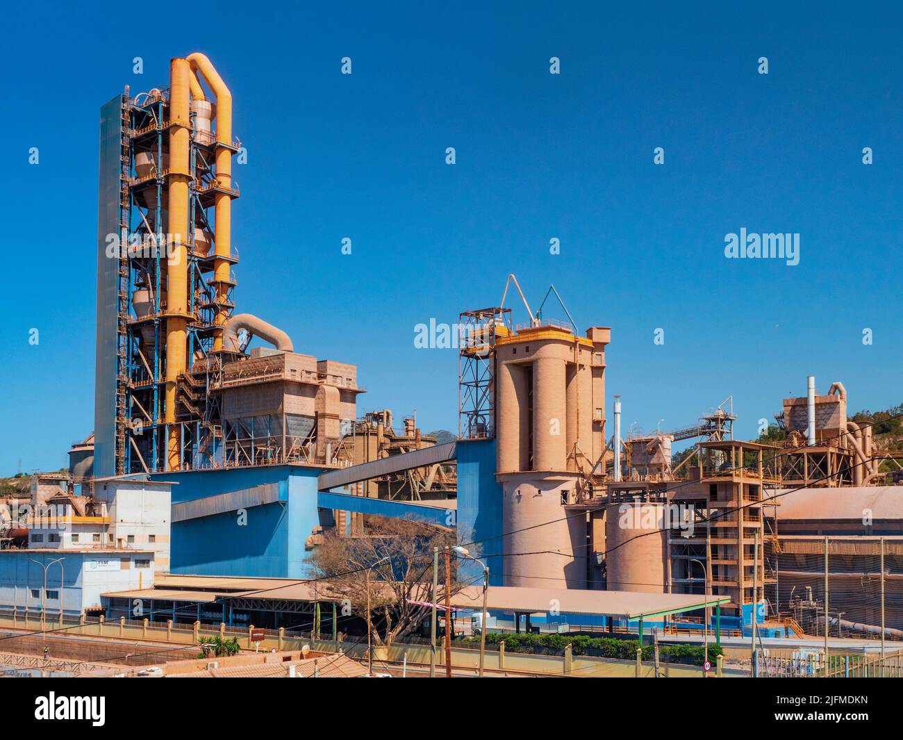 Cement factory in front of the sea on the coast of Málaga Stock Photo ...