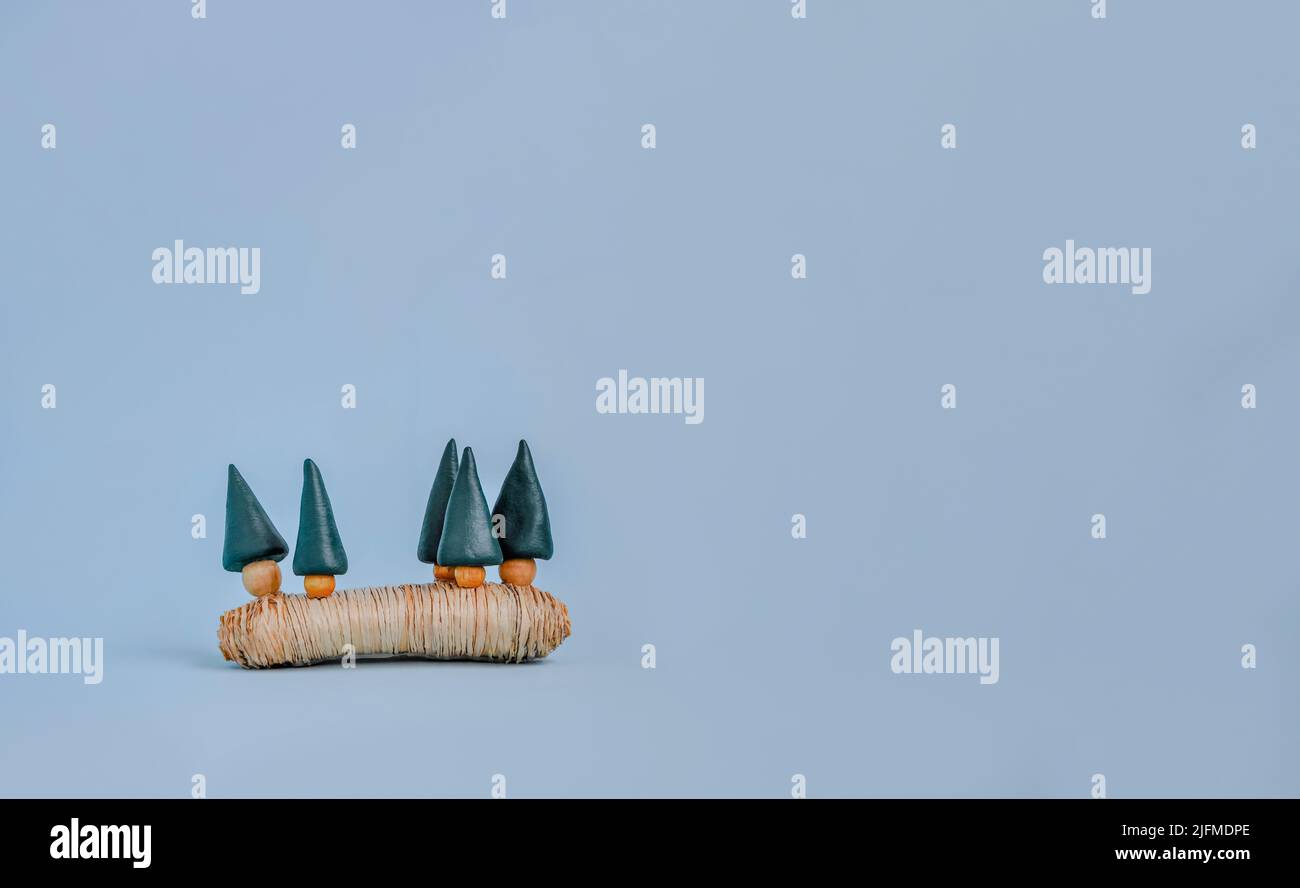 Eco-friendly planet. Symbolic forest made of clay. Minimal nature ...