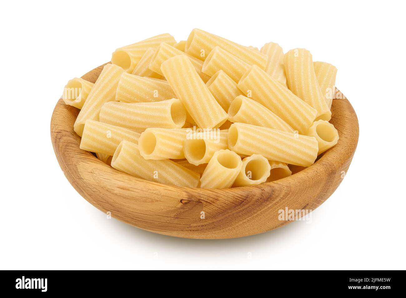 raw italian tortiglioni pasta in wooden bowl isolated on white ...