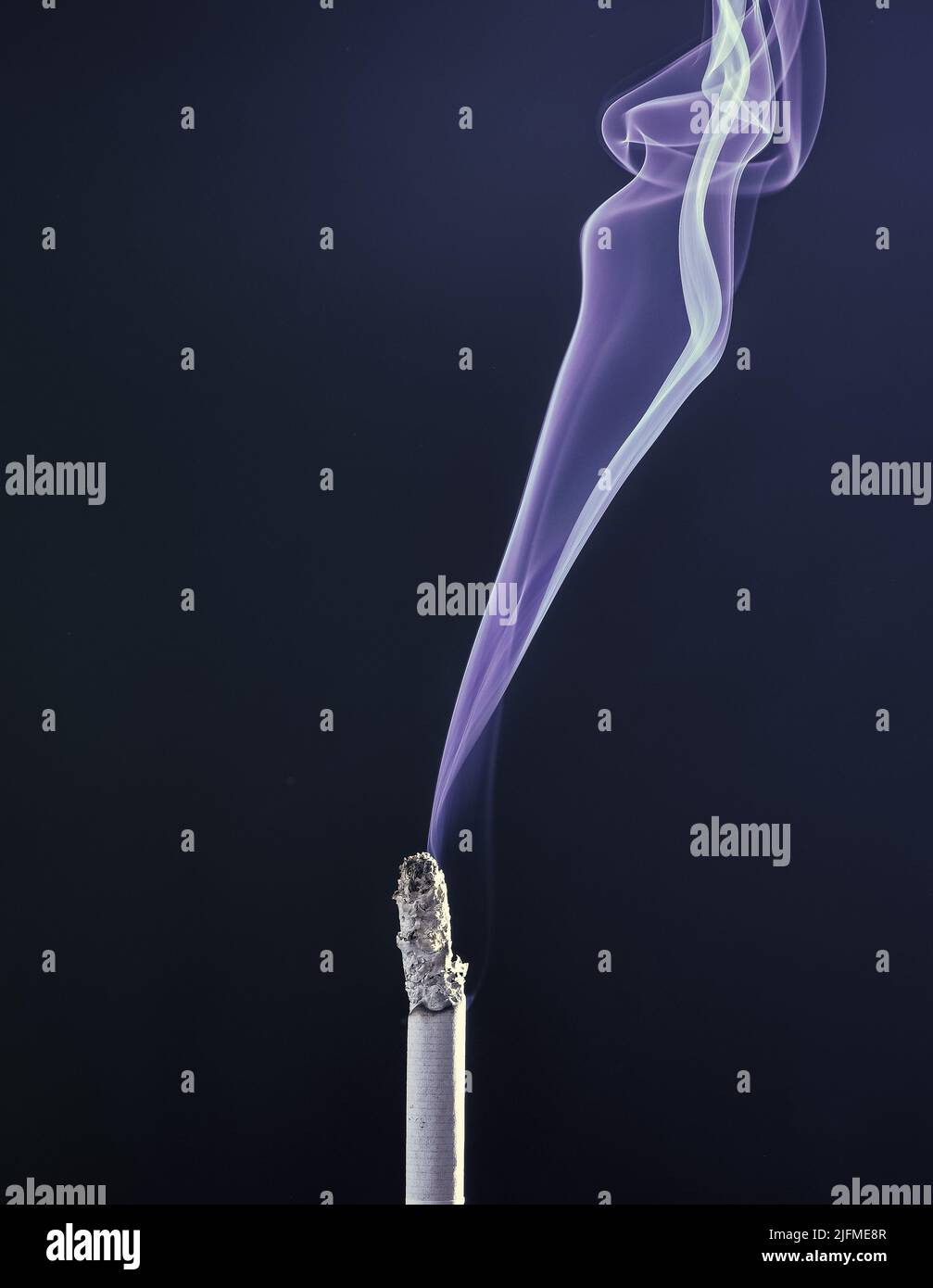 Burning cigarette with wisp of smoke dark background, smoking Stock ...