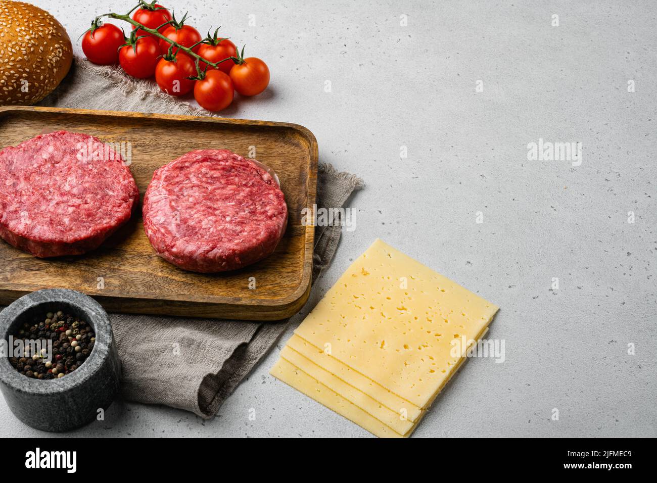 Home Handmade Raw Minced Beef steak burgers on gray stone table ...