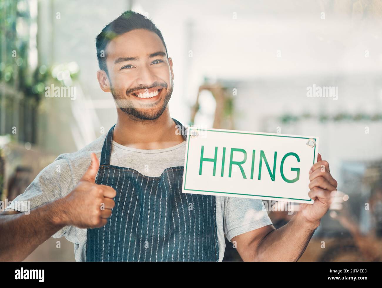 Guy holding sign hi-res stock photography and images - Alamy
