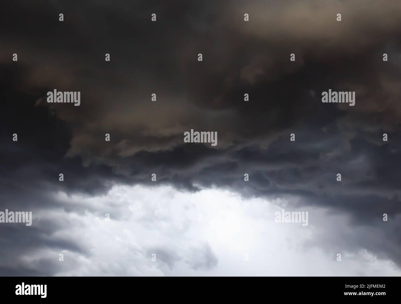 Dark storm clouds before rain, with strange cloud shapes. Storm clouds formed during the rainy ...