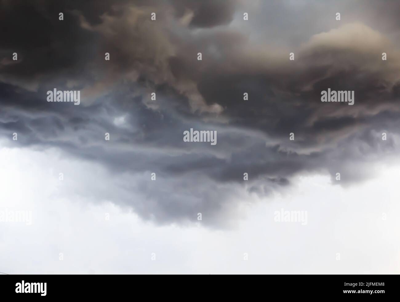 Dark storm clouds before rain, with strange cloud shapes. Storm clouds ...