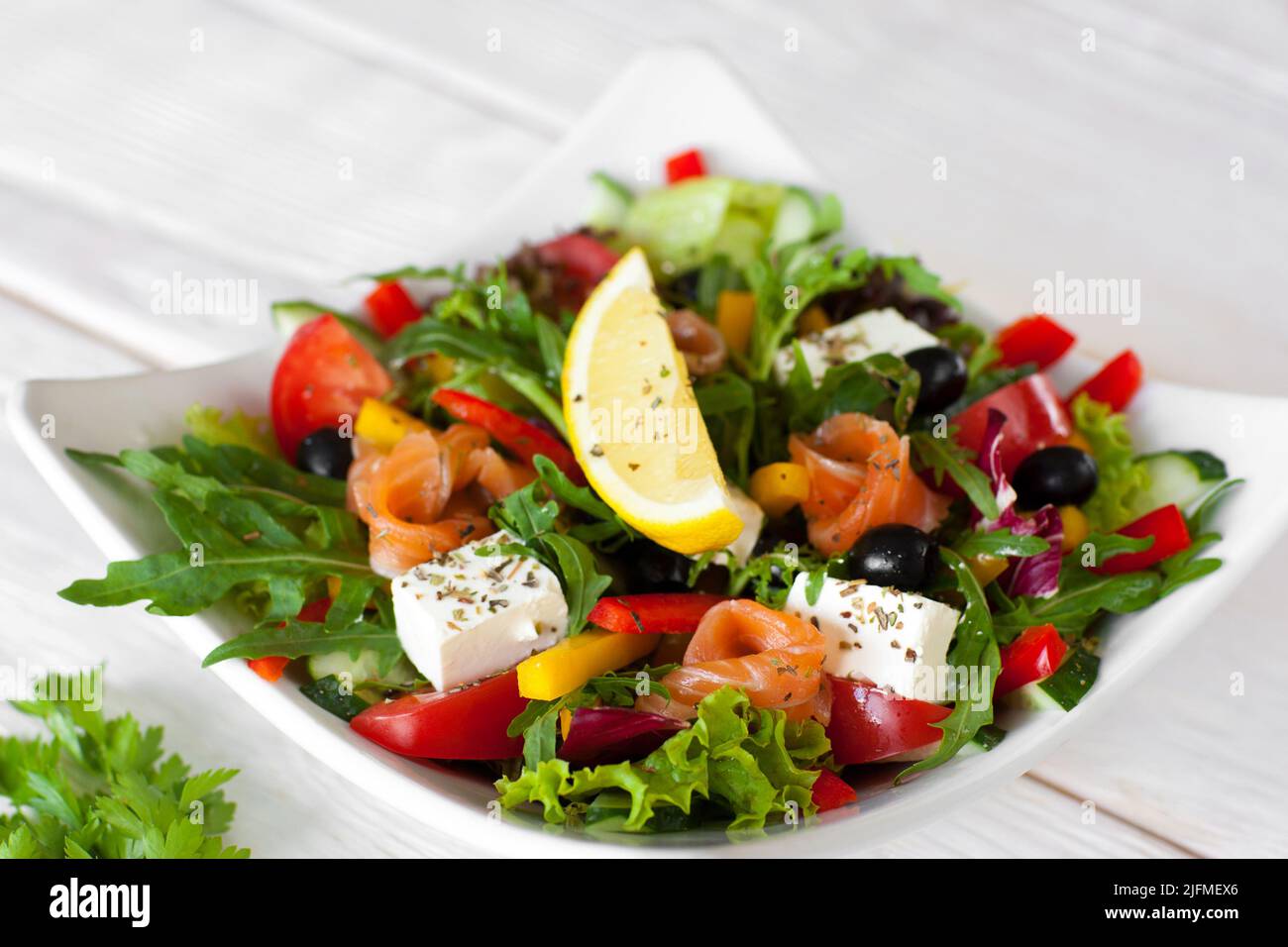 Salmon salad traditional serving on wood Stock Photo - Alamy