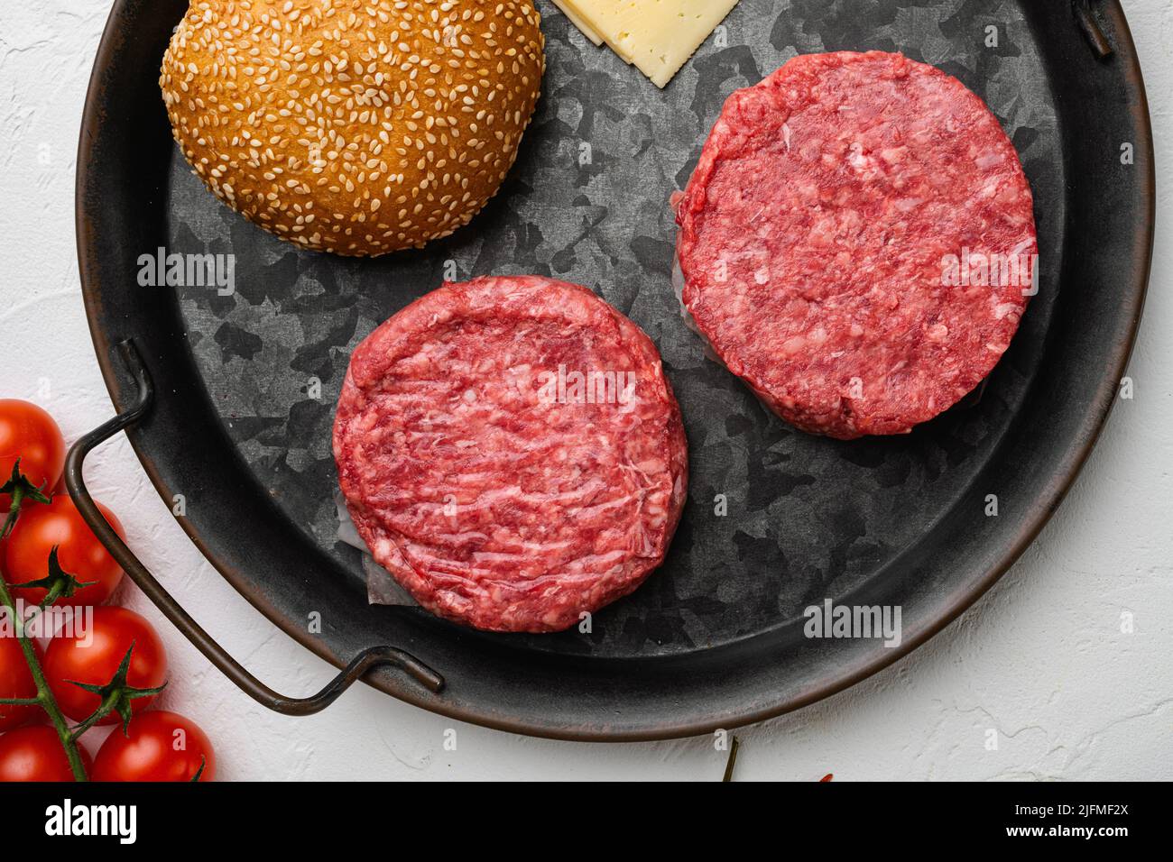 Burger patty on white stone table background, top view flat lay Stock ...