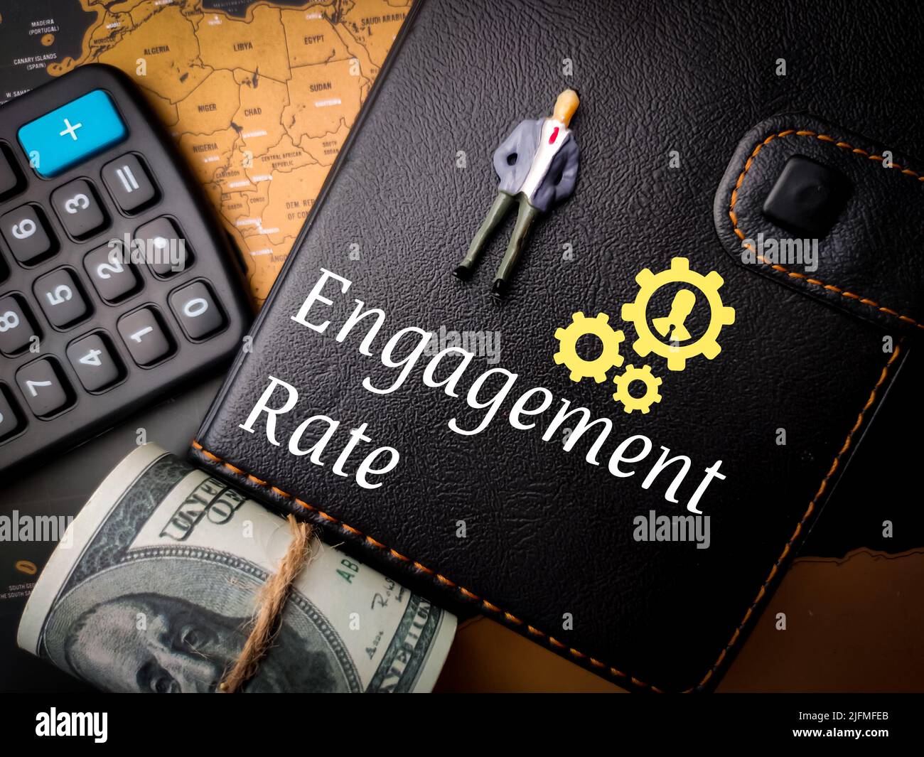 Notebook,calculator,banknotes,miniature people and icon with text ...