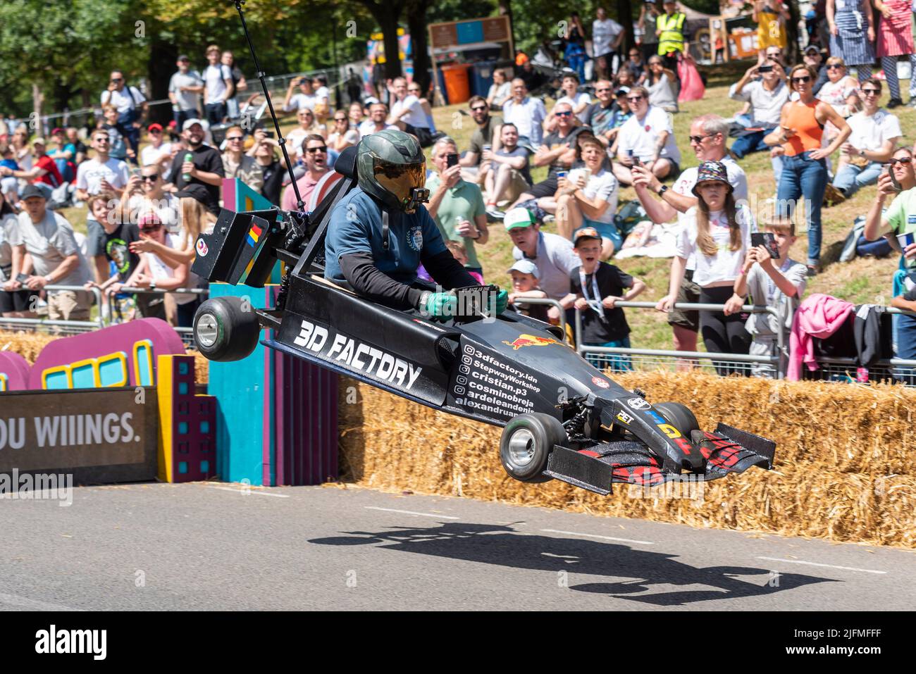 Team 3D Factory kart taking the final jump at the Red Bull Soapbox race ...