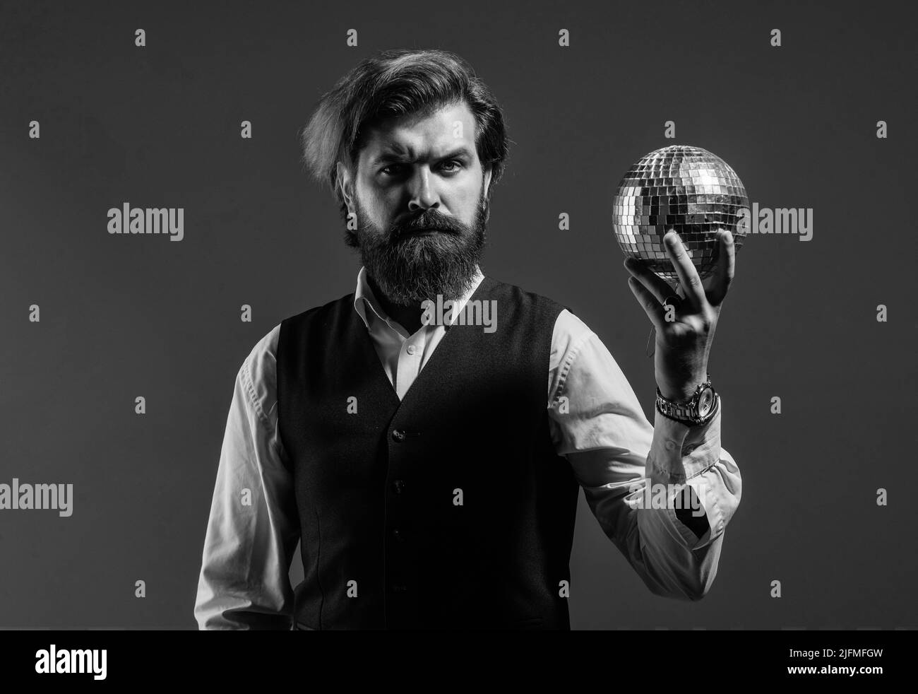 man with beard hold mirror disco ball. concept of corporate party ...