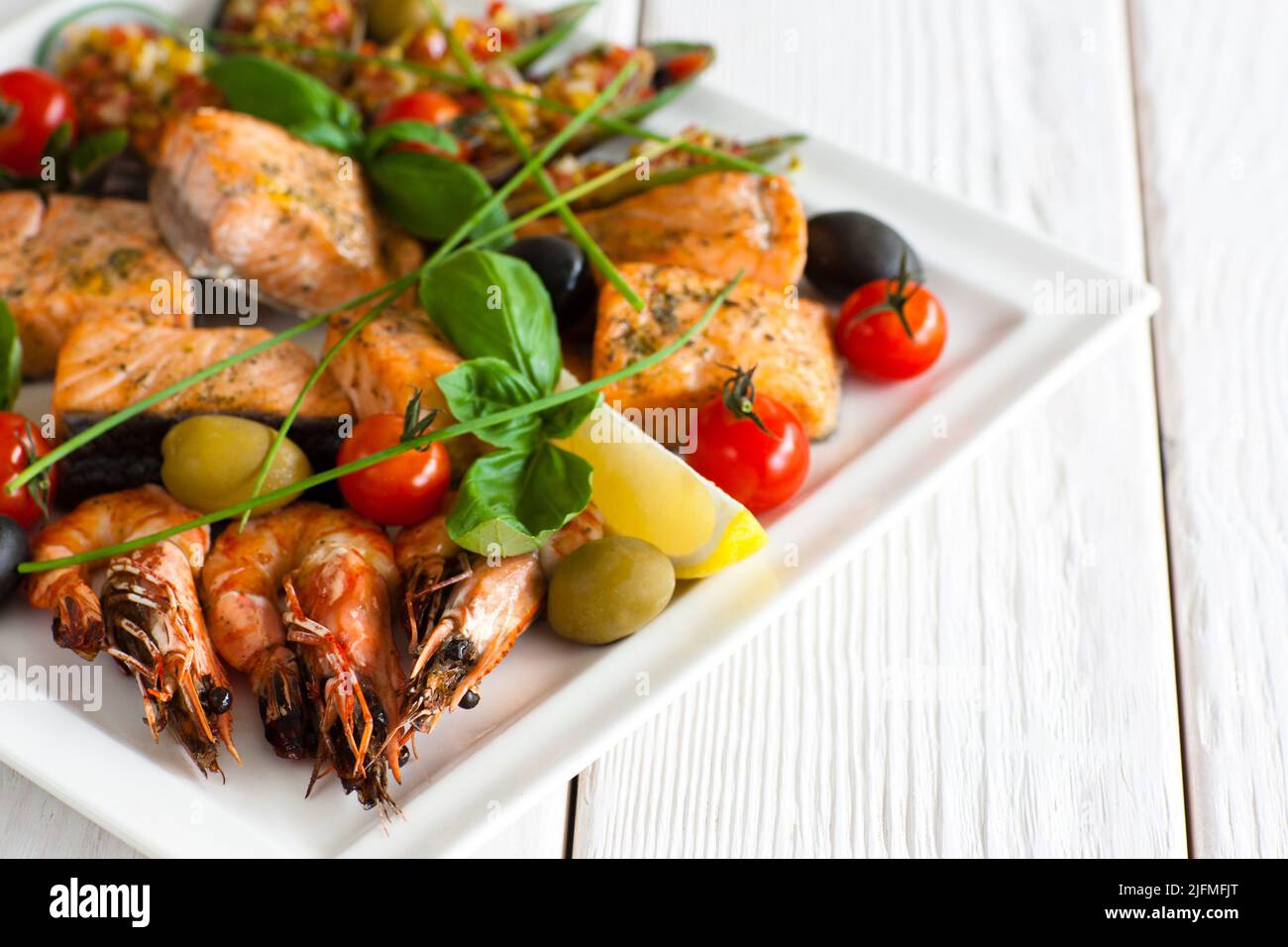 Greek cuisine - traditional grilled seafood plate Stock Photo - Alamy
