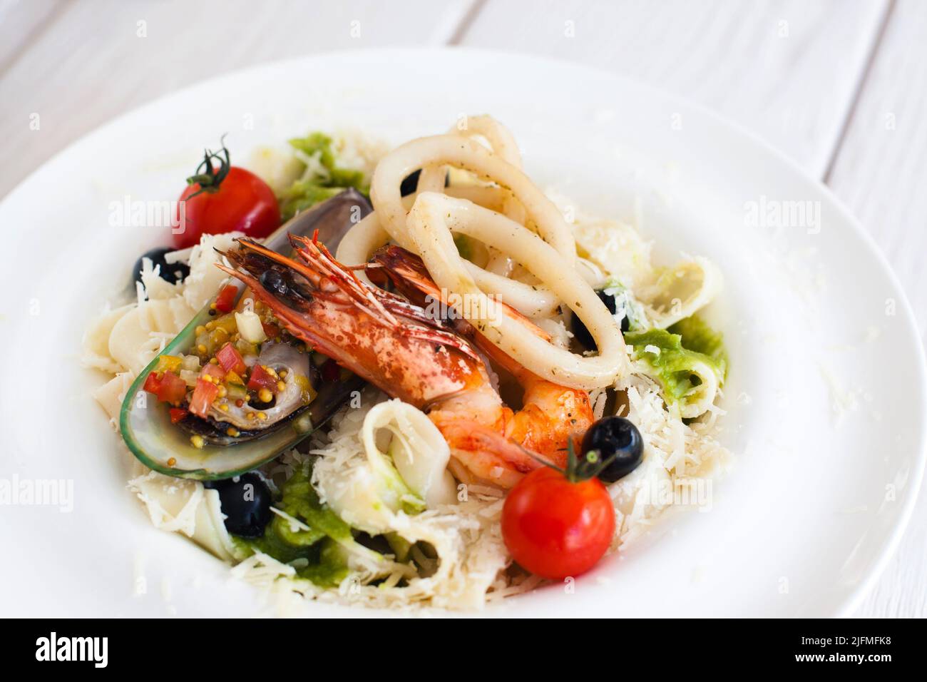 Assorted cooked seafood with pasta closeup Stock Photo - Alamy
