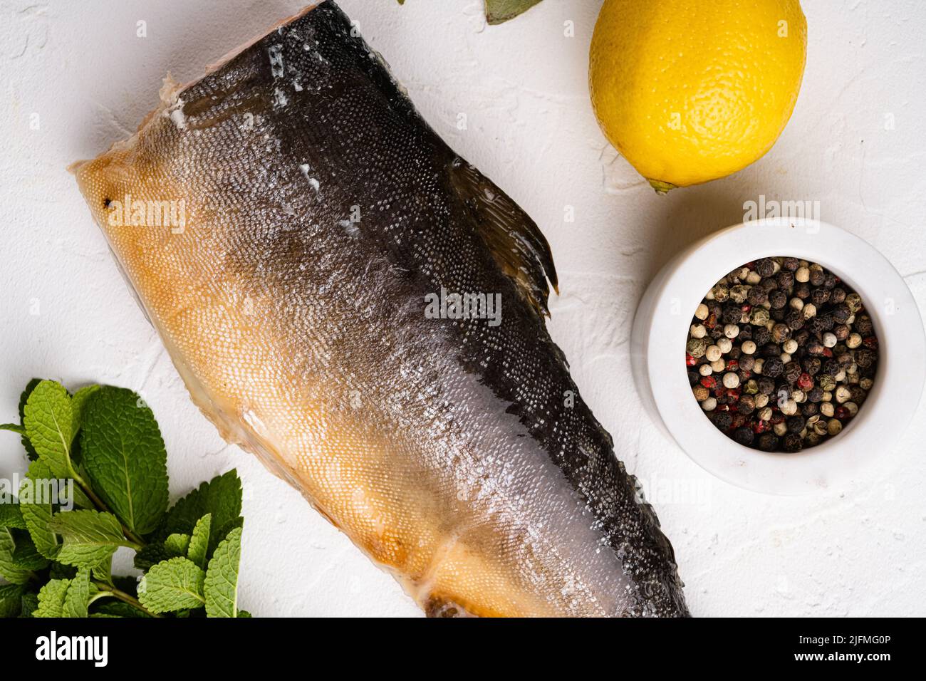 Whole smoked trout fish, on white stone table background, top view flat ...