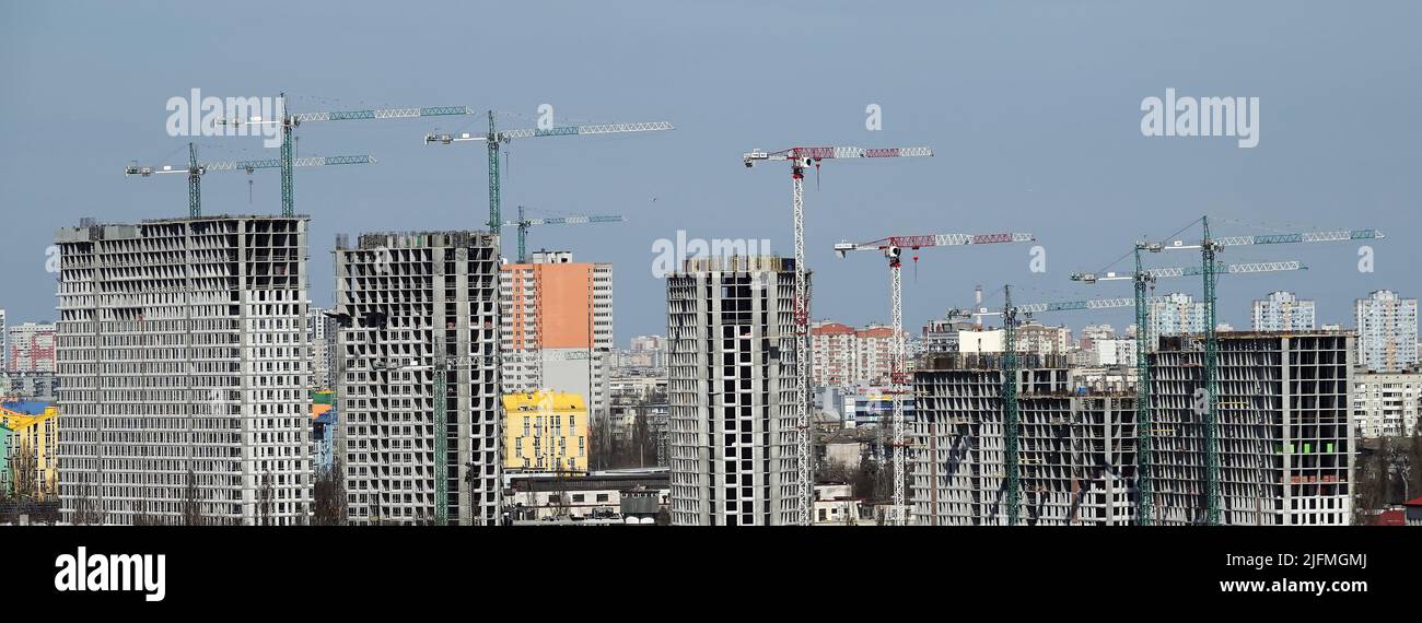 Kyiv, Ukraine April 7, 2022: tower construction cranes build high-rise ...
