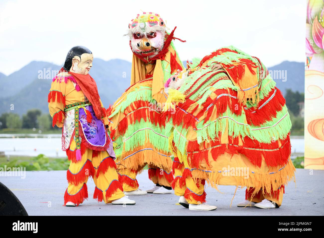 QIANXINAN, CHINA - JULY 4, 2022 - People perform a lion dance at ...