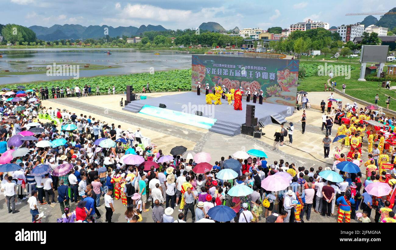 QIANXINAN, CHINA - JULY 4, 2022 - People perform a lion dance at ...