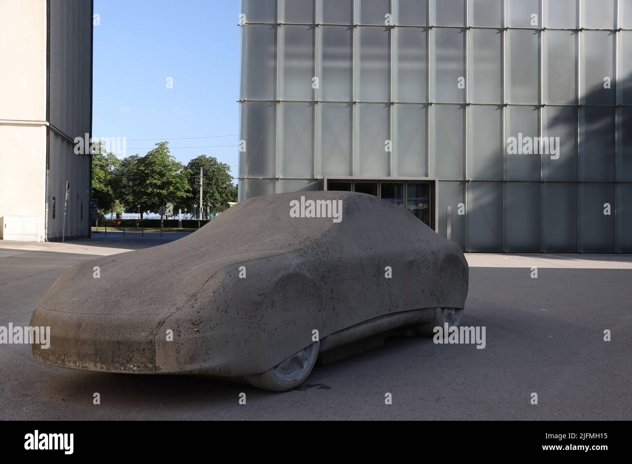 This car is parked and made out of concrete. Much cheaper than a real ...