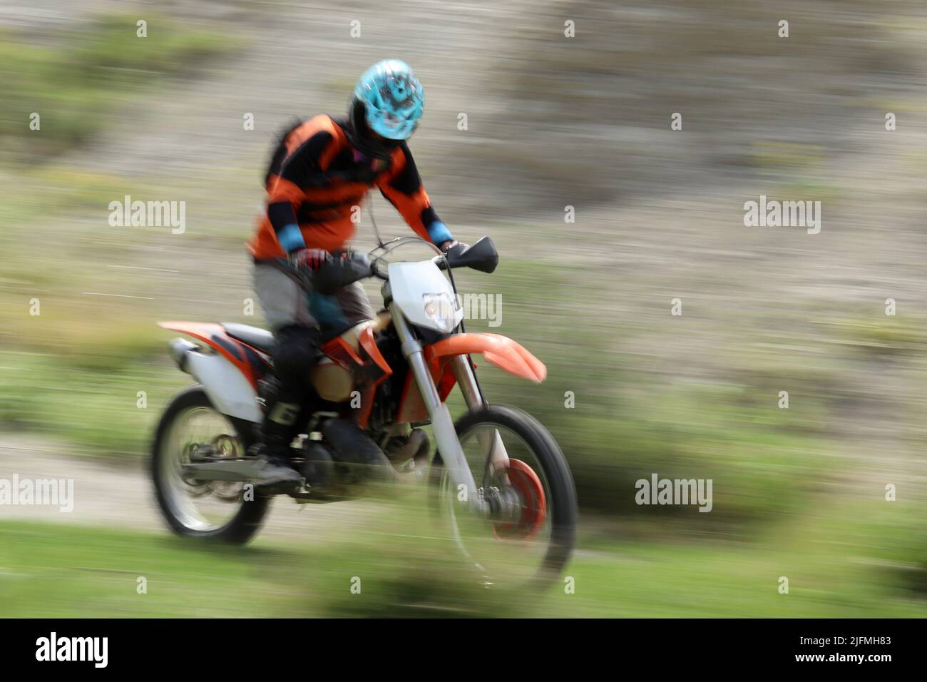 Blurry image of motorcycle riders during motocross race Stock Photo - Alamy