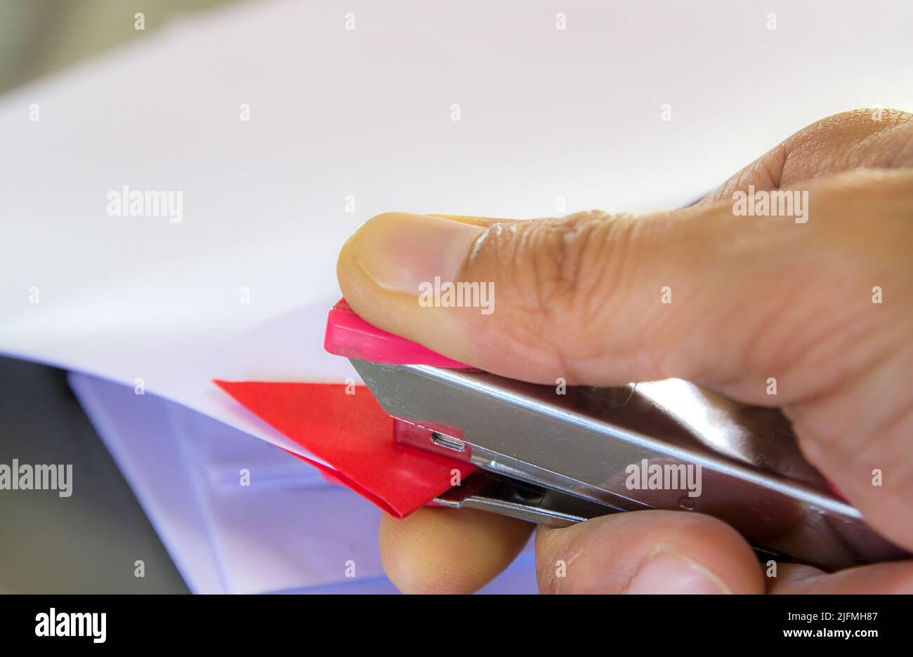 Hands with papers and stapler in office Stock Photo - Alamy