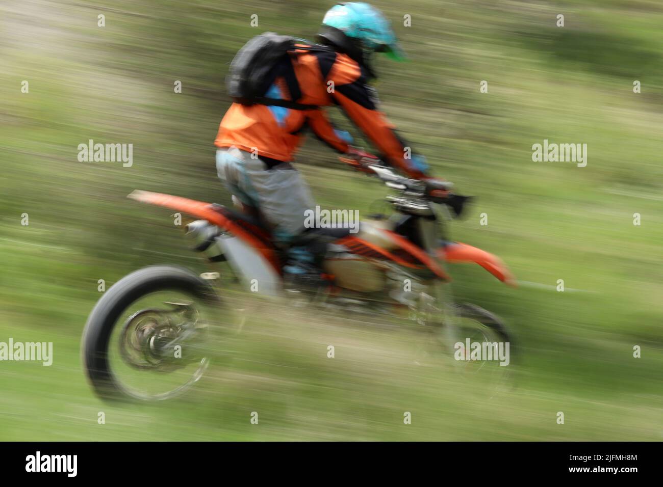 Blurry image of motorcycle riders during motocross race Stock Photo - Alamy